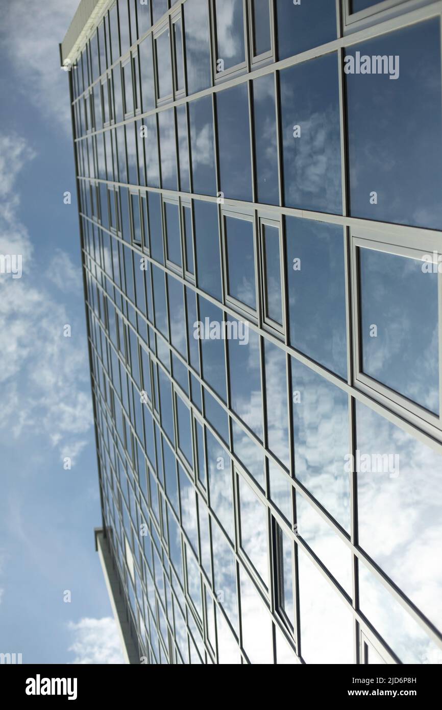 Building is made of glass. Mirror surface in office building. Many ...