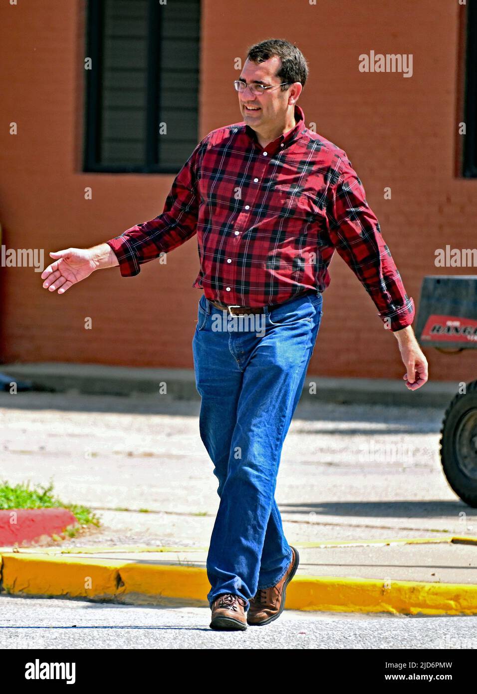 COUNCIL GROVE, KANSAS - JUNE 18, 2022 Derek Schmidt (red plaid shirt ...