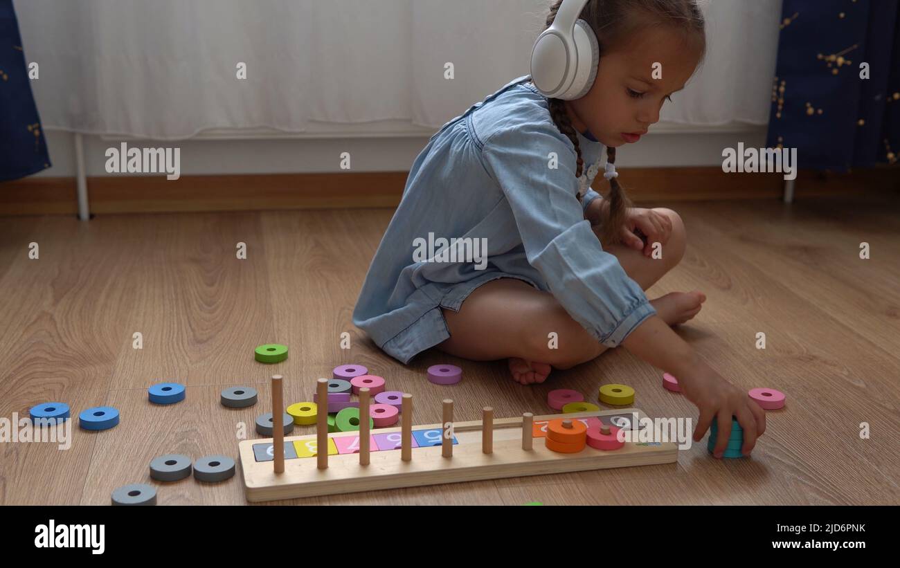 Happy Little Preschool Toothless Girl Playing With Colored Wooden Toy ...
