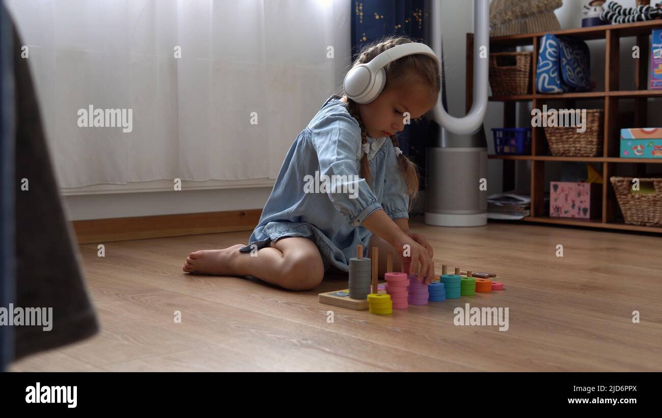 Happy Little Preschool Toothless Girl Playing With Colored Wooden Toy ...