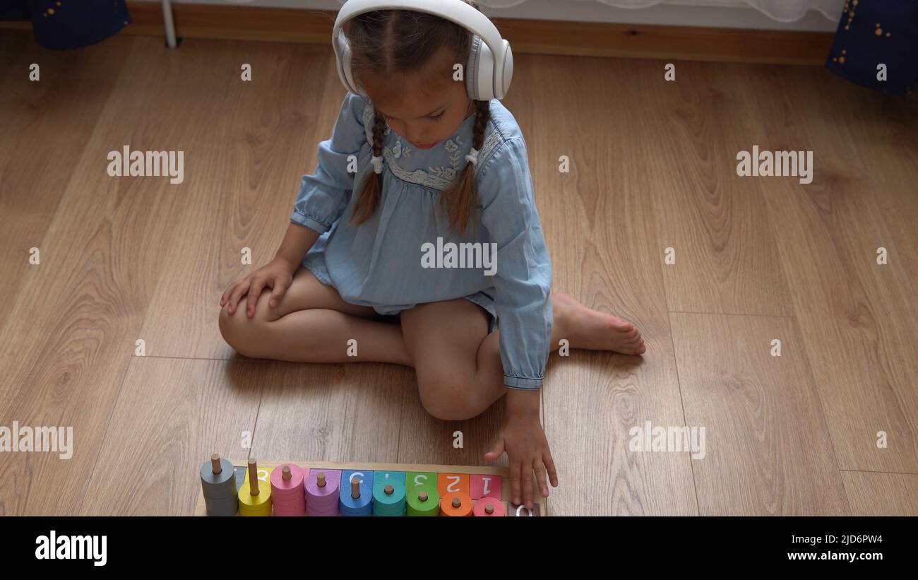 Happy Little Preschool Toothless Girl Playing With Colored Wooden Toy ...