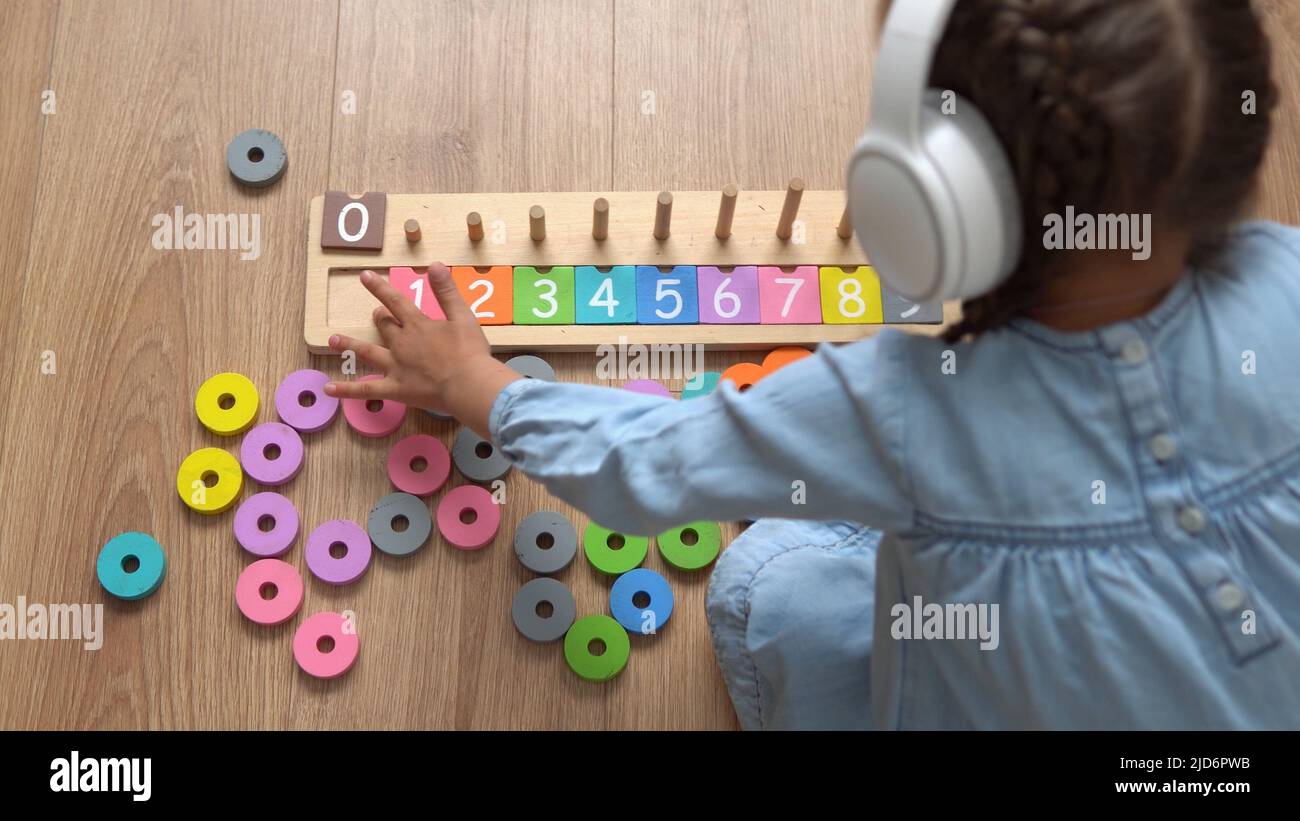 Happy Little Preschool Toothless Girl Playing With Colored Wooden Toy ...