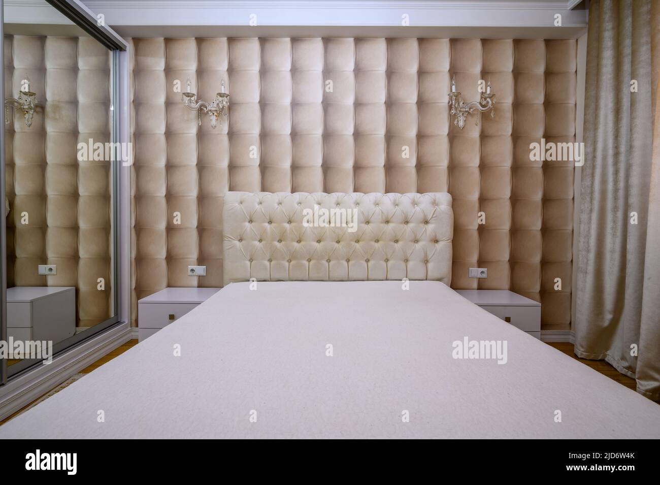 Luxury well designed modern beige bedroom, front view Stock Photo - Alamy