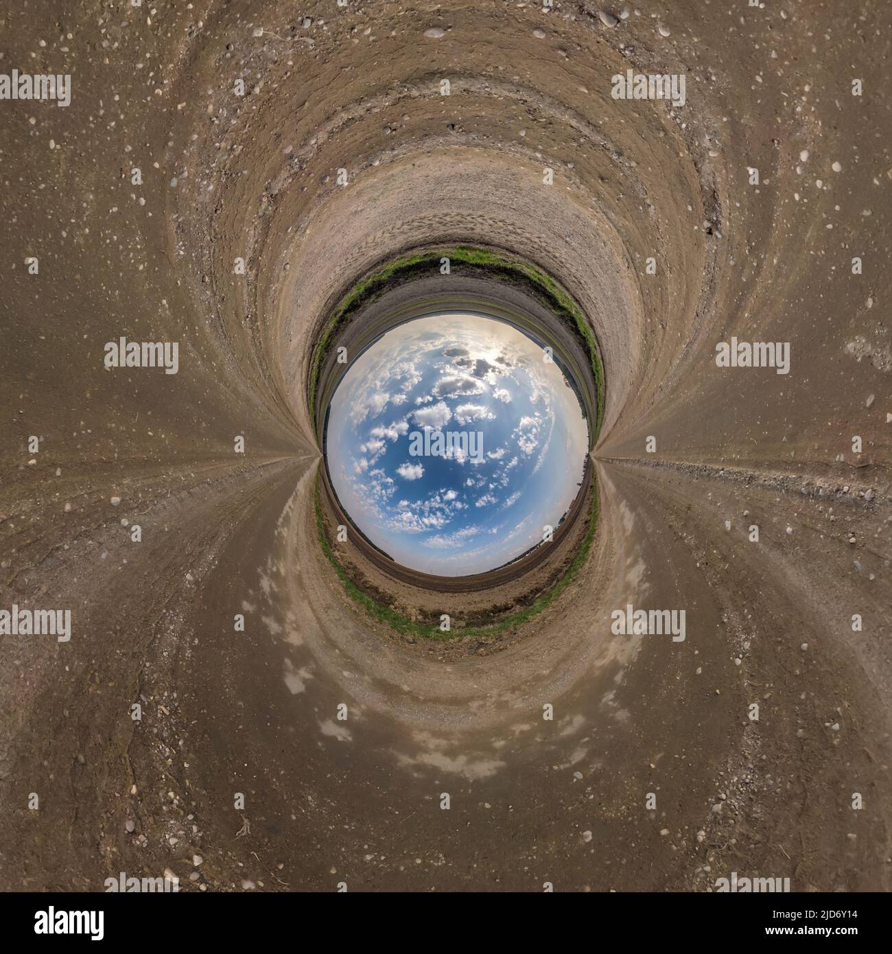 blue sphere little planet inside gravel road or field background ...