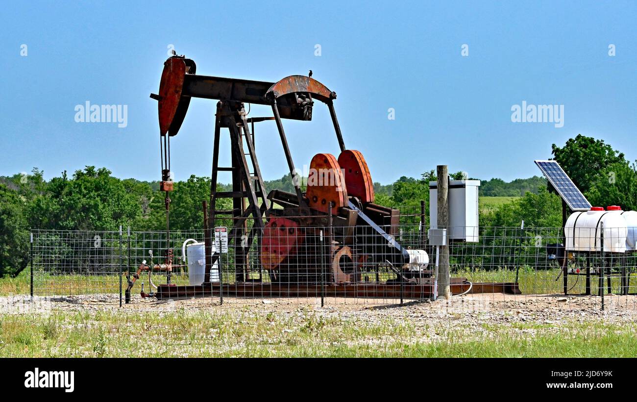 AMERICUS, KANSAS - JUNE 18, 2022 Pumpjack reciprocating piston pump ...