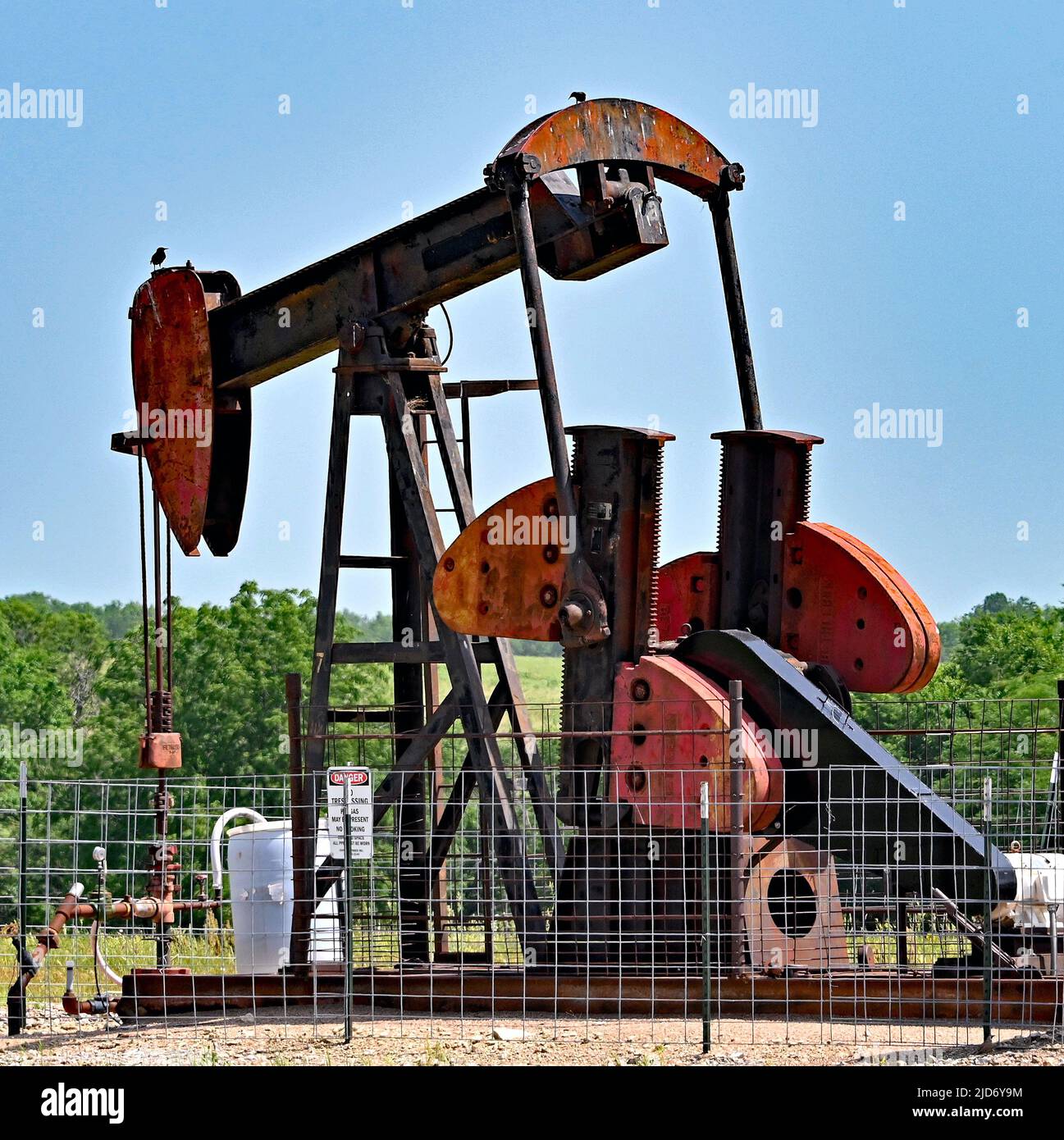 AMERICUS, KANSAS - JUNE 18, 2022 Pumpjack reciprocating piston pump ...