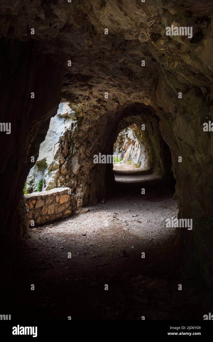 Tunnels excavated in the rock on the Cares river path Stock Photo - Alamy