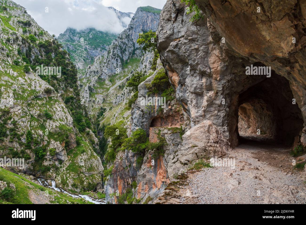 Tunnels excavated in the rock on the Cares river path Stock Photo - Alamy
