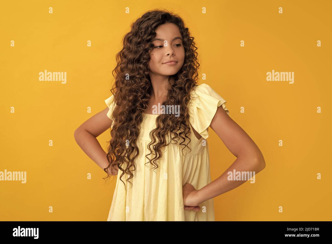 arrogant kid with long curly hair and perfect skin, portrait Stock ...