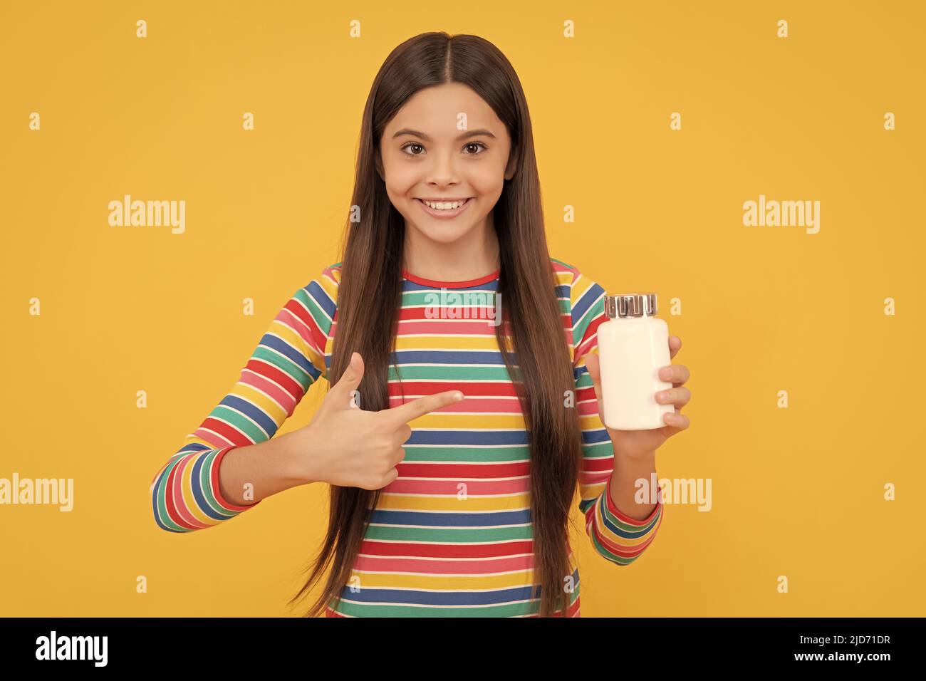happy child pointing finger on natural food additives or vitamin pills ...