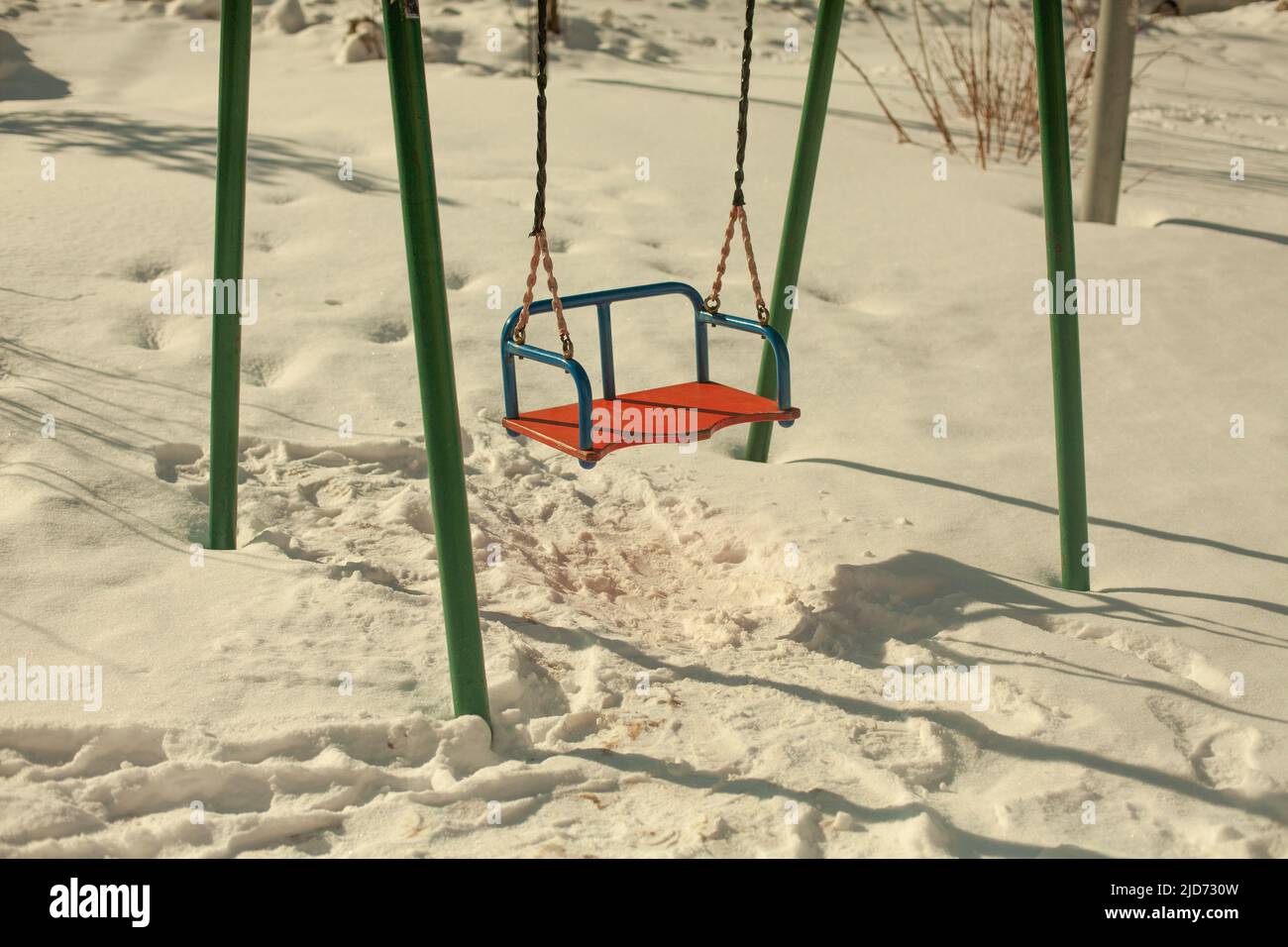 Playground with swings covered with snow in wales hi-res stock ...