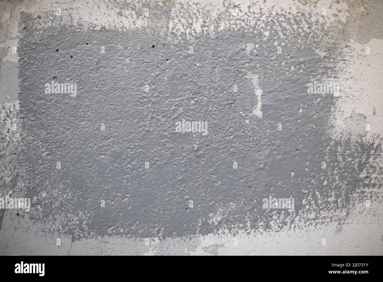 Wall is in gray paint. Texture of wall of building. Repairable surface ...