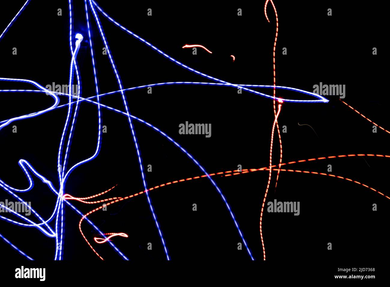 Chaotic lines in dark. Neon glow. Texture of bright lines. Glow on ...