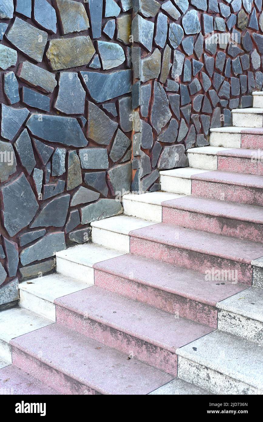 A stone mosaic texture wall with stairs Stock Photo - Alamy