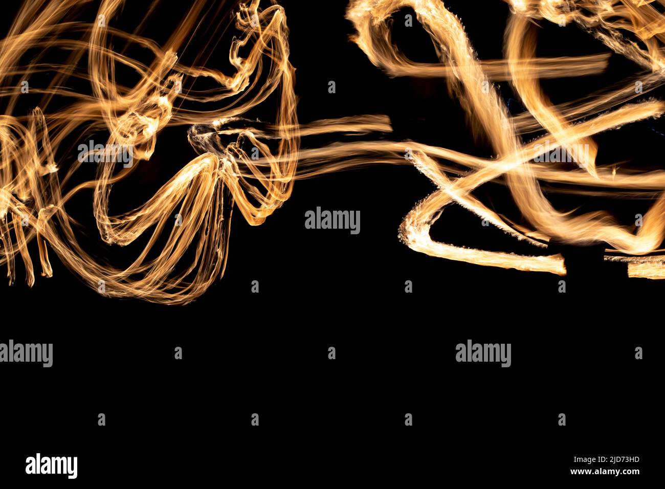Circles of flames in dark. Fire show on long camera shutter speed ...