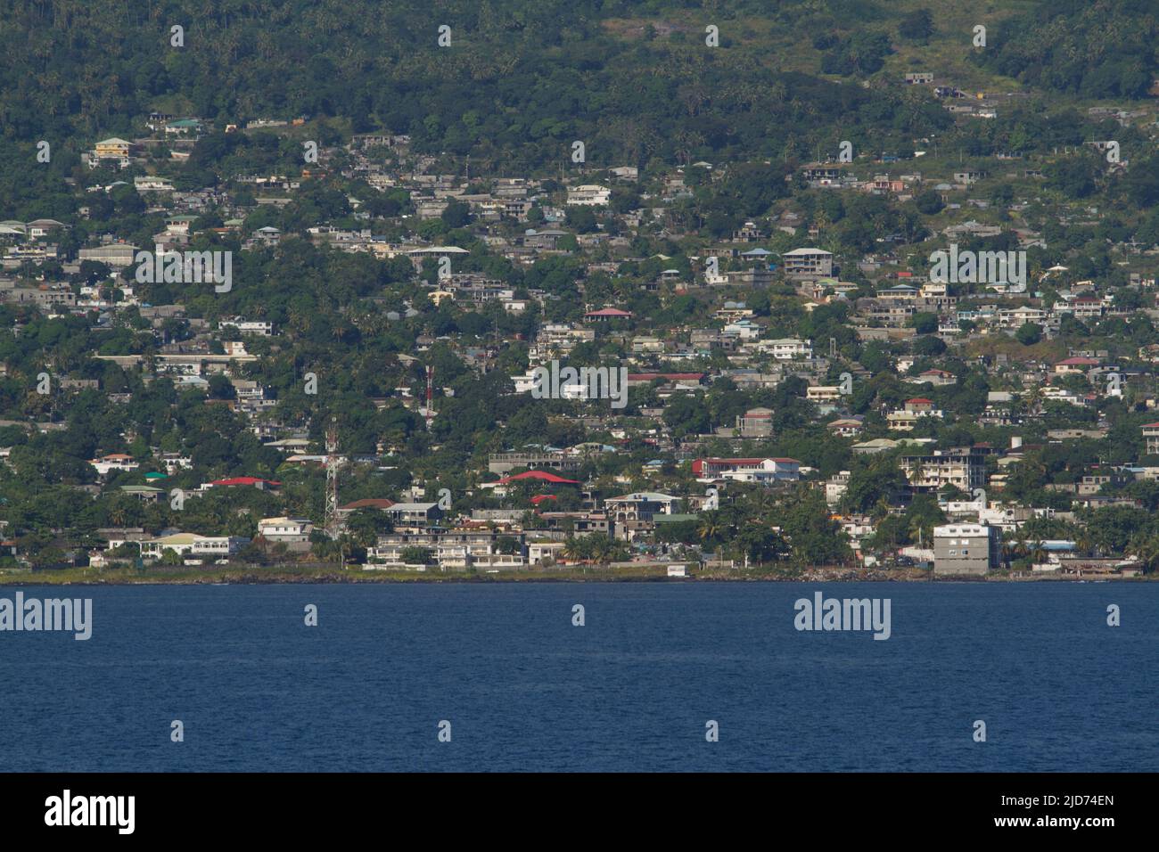View of the buildings on the slope of a mountain in Moroni Island of ...