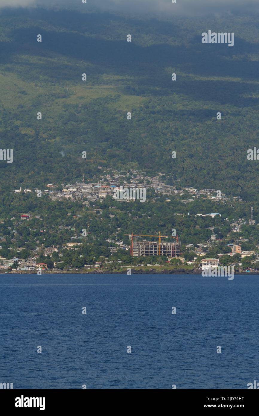 View of the buildings on the slope of a mountain in Moroni Island of ...