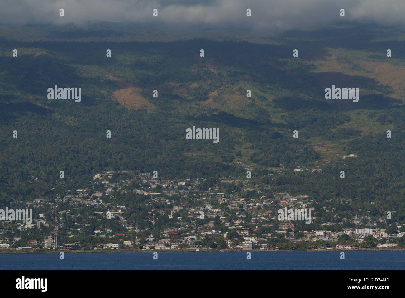 View of the buildings on the slope of a mountain in Moroni Island of ...
