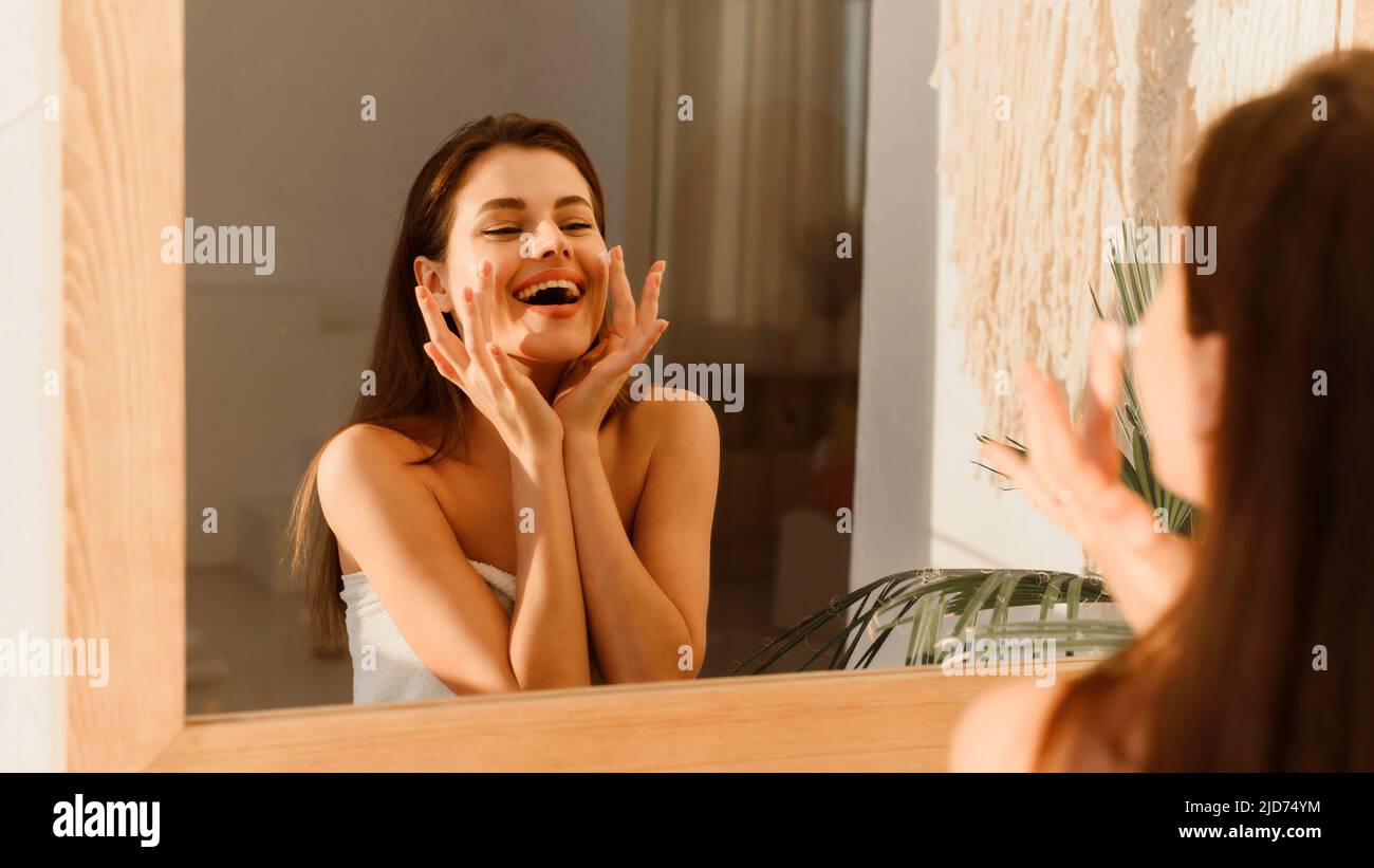 Happy woman doing daily routine moisturizing skin in the morning. Web ...