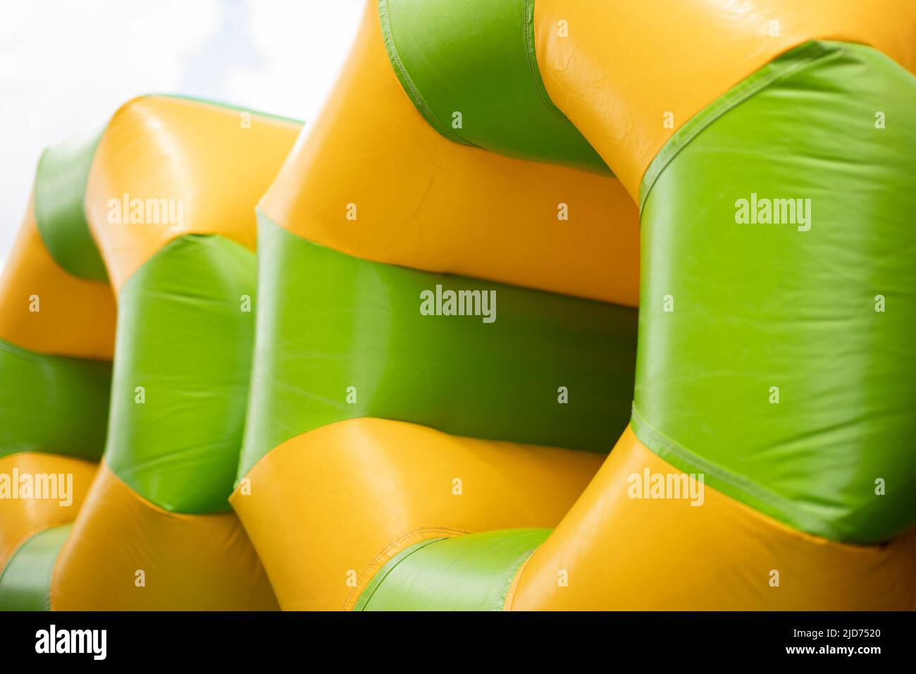 Inflatable pipe on playground. Obstacle course in amusement park ...
