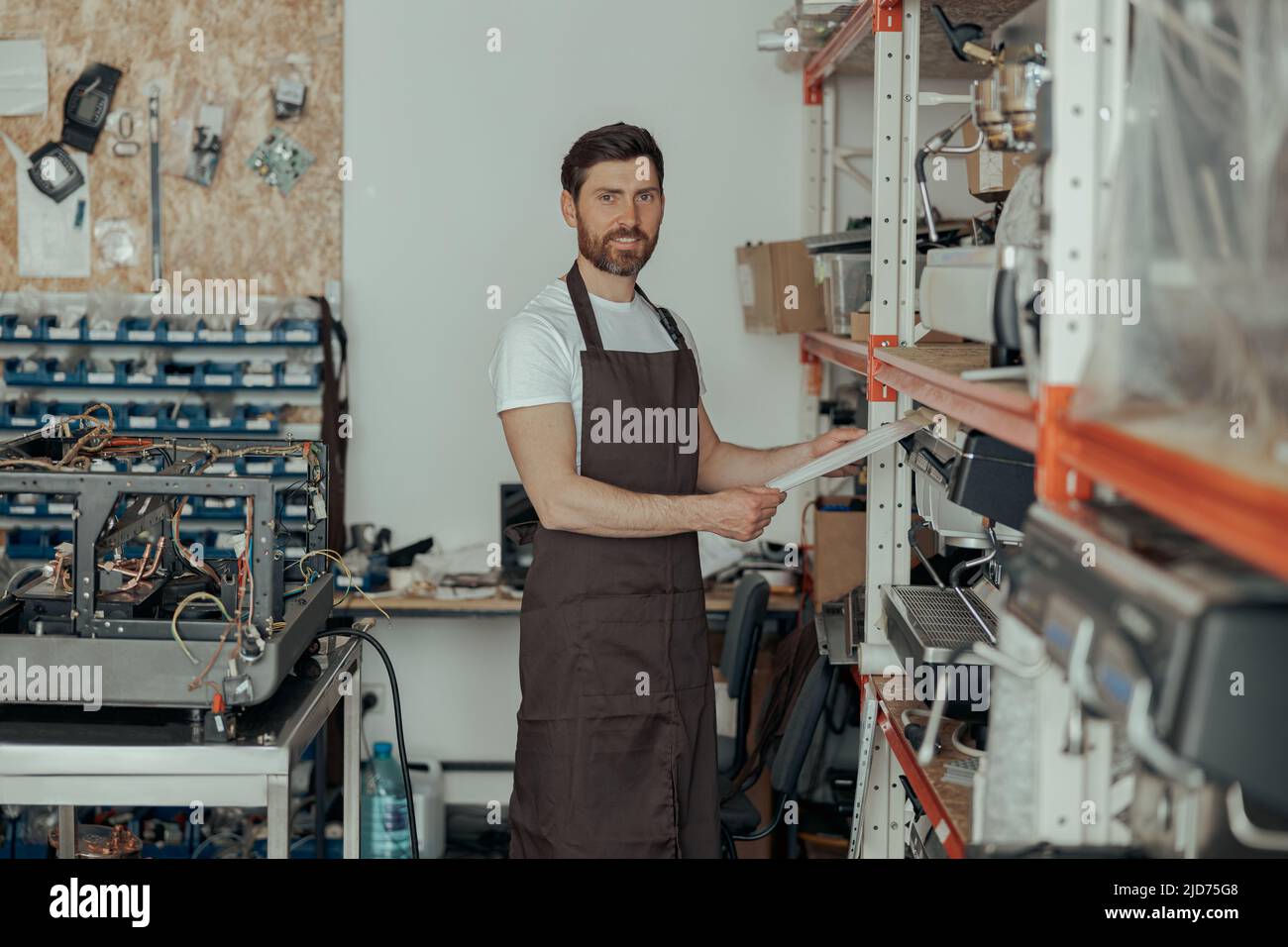 Business owner working on workshop with different coffee machines Stock ...