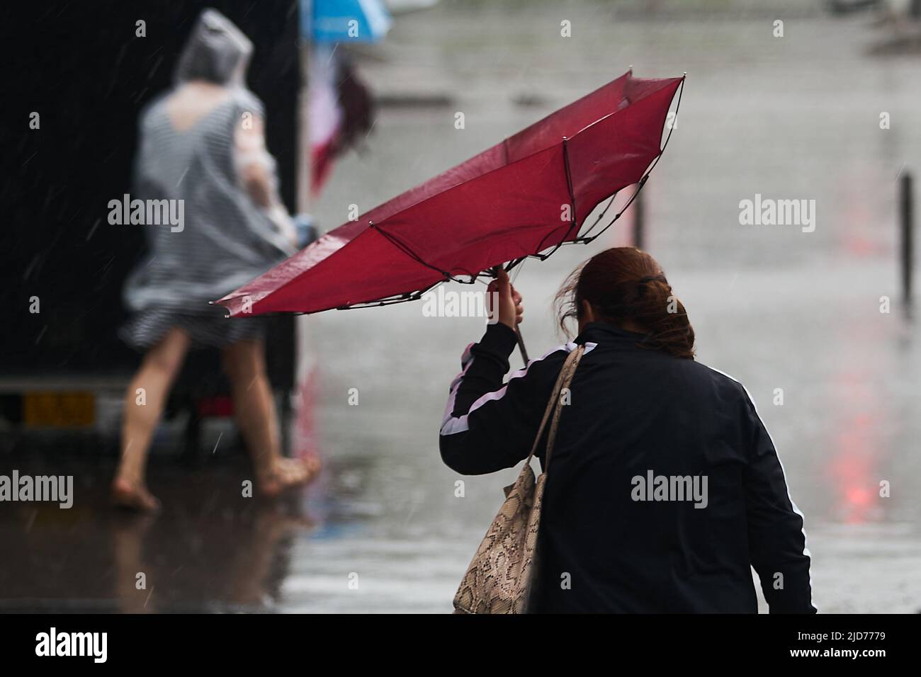 Bucharest, Romania - June 17, 2022: People cross the street during ...