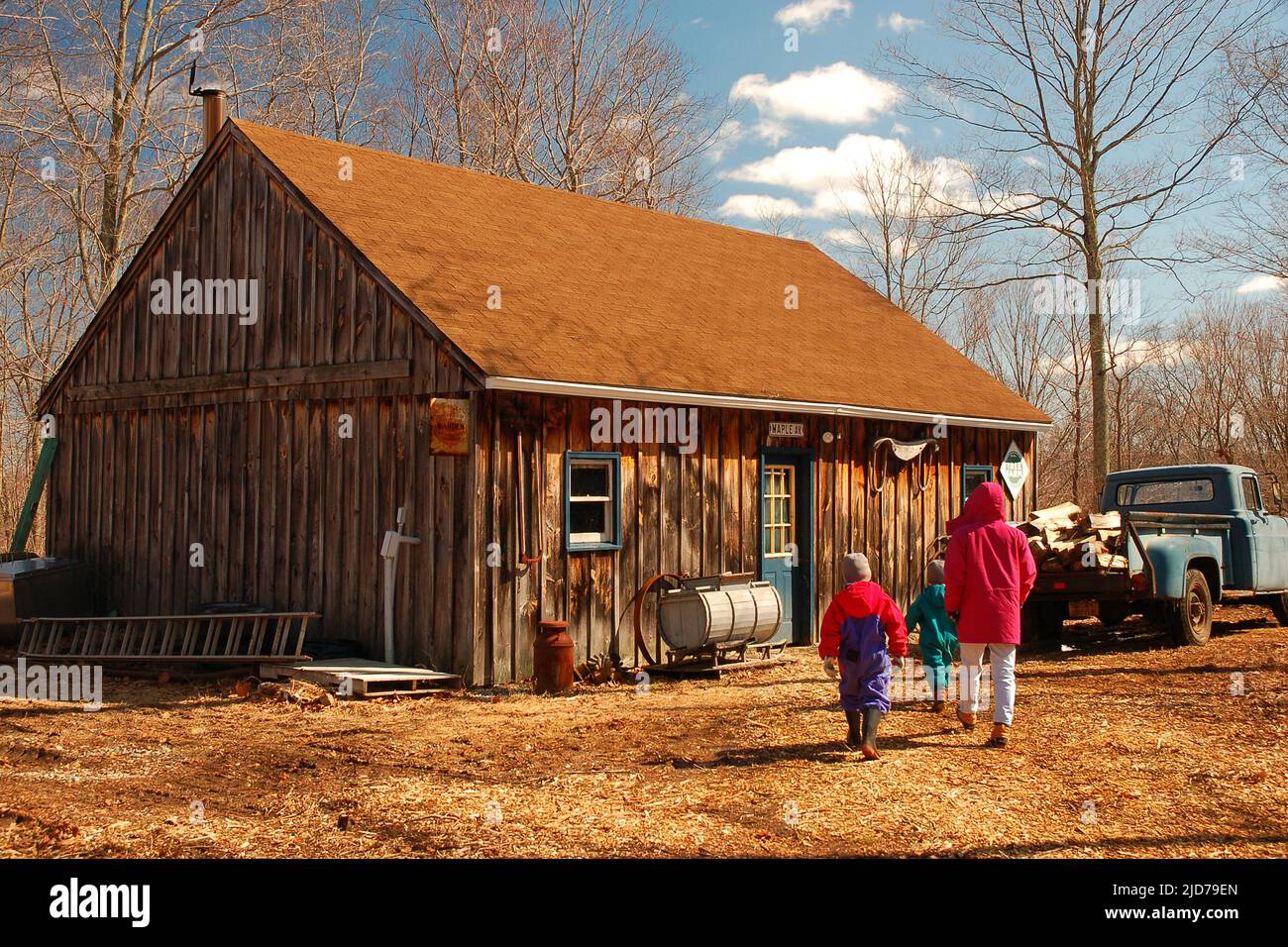 A family approaches a rustic sugar shack in New England, learning how ...