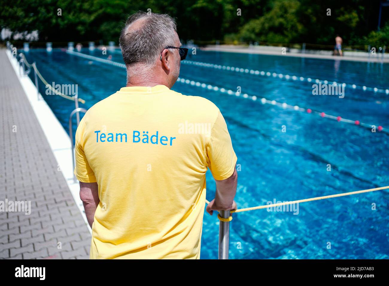 Mannheim, Germany. 17th June, 2022. A lifeguard stands at a pool in the ...