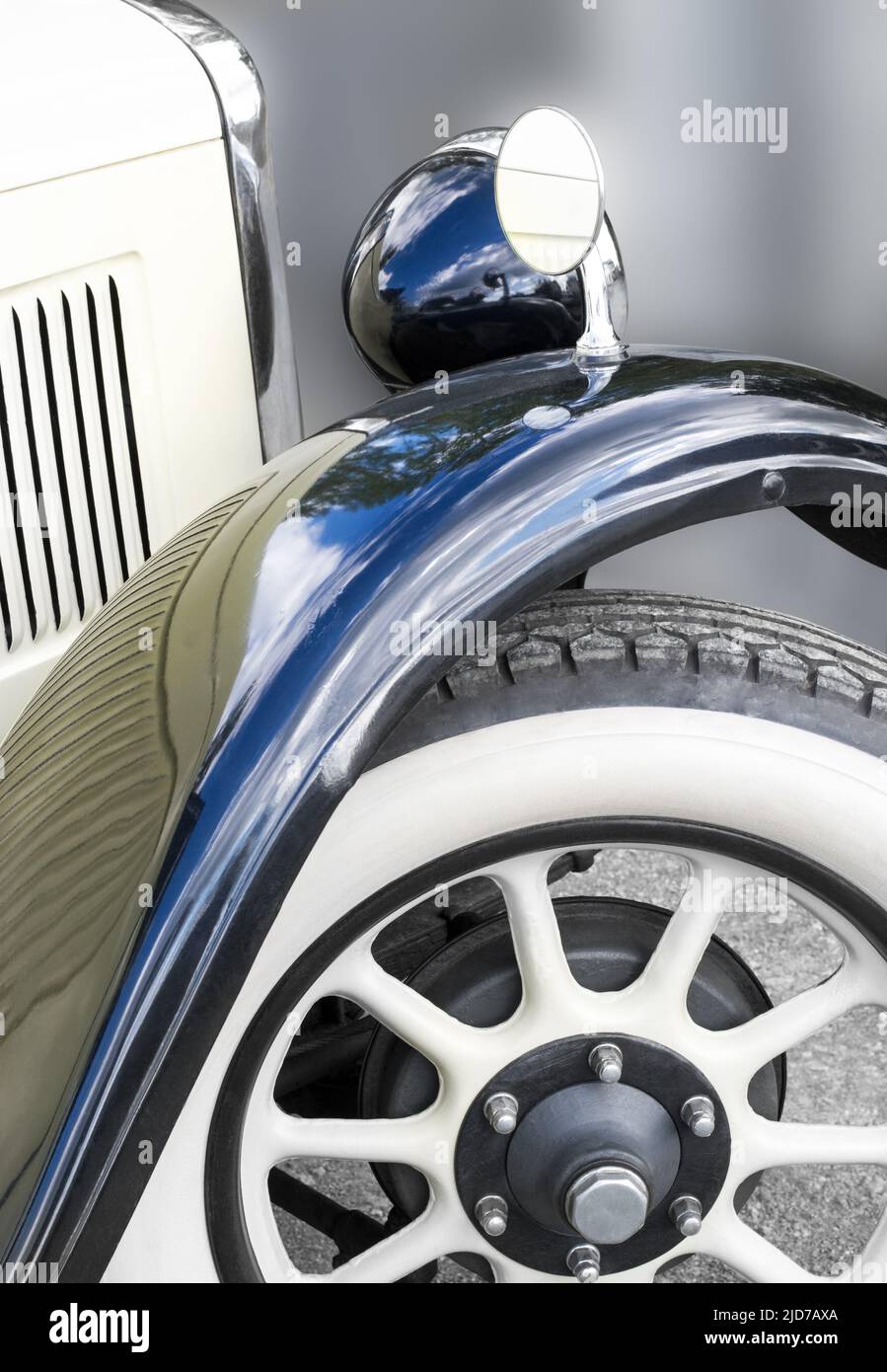 Part of a car with a retro style round mirror, vertical format Stock ...