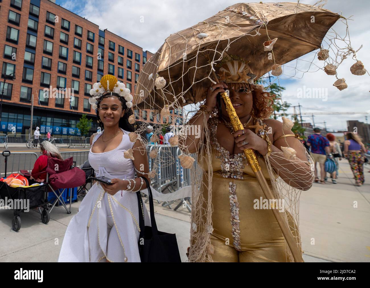 Women dressed as mermaids make their way to the start of the parade ...
