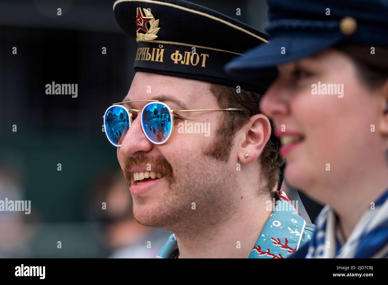 A man and woman look down the Mermaid Parade route. The Coney Island ...