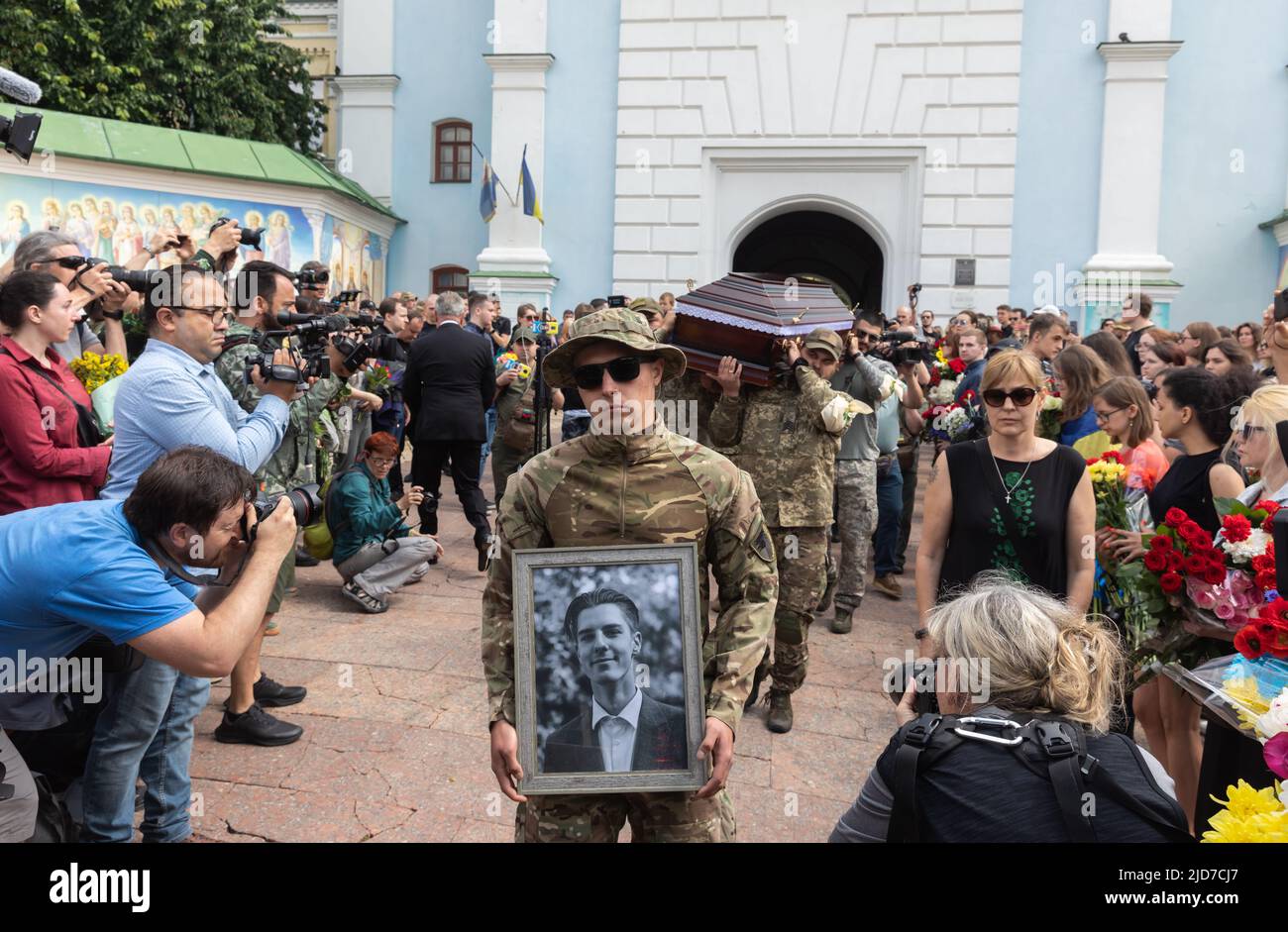 Soldiers carry a coffin with body of the famous soldier and activist ...