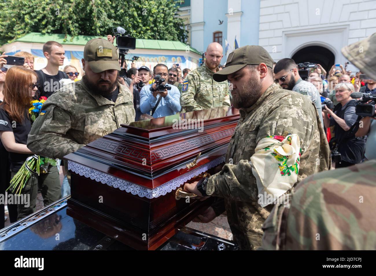 Soldiers carry a coffin with body of the famous soldier and activist ...