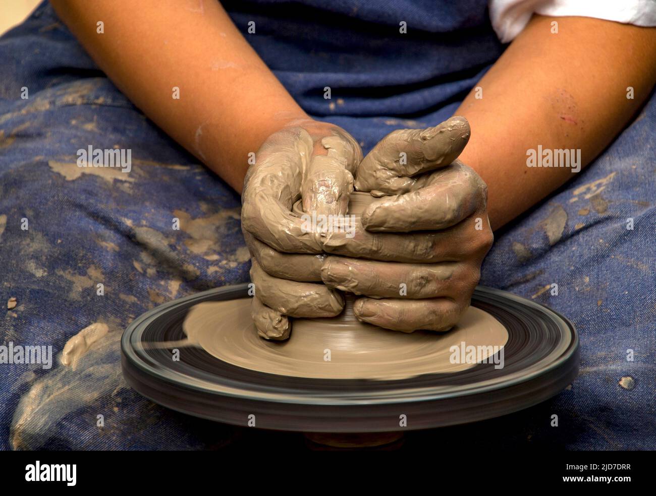 Potter modeling ceramic pot from clay on a potter's wheel Stock Photo ...