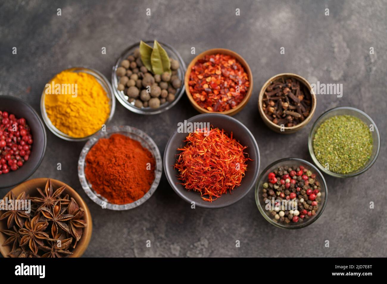 Assortment of natural spices on dark rustic stone background, Healthy ...