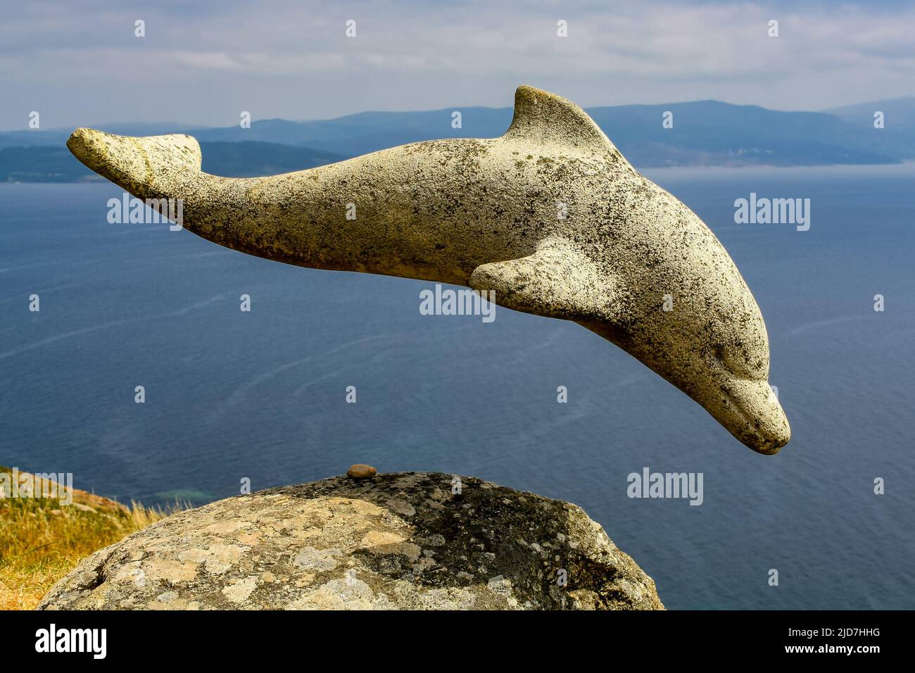 Dolphin sculpture on rock hi-res stock photography and images - Alamy