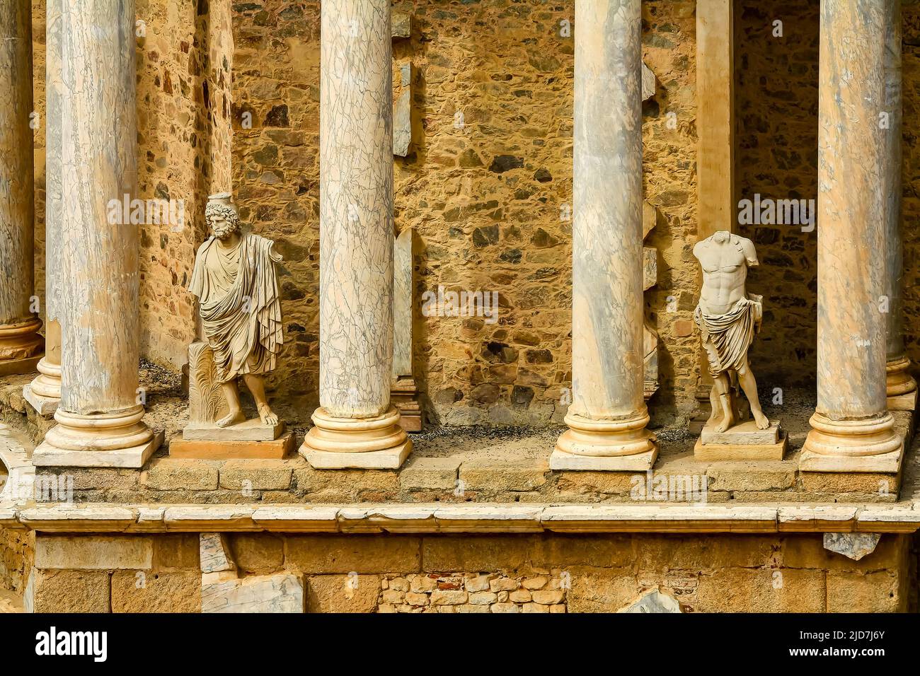 Detail of columns and statues in the public Roman theater of Mérida in ...