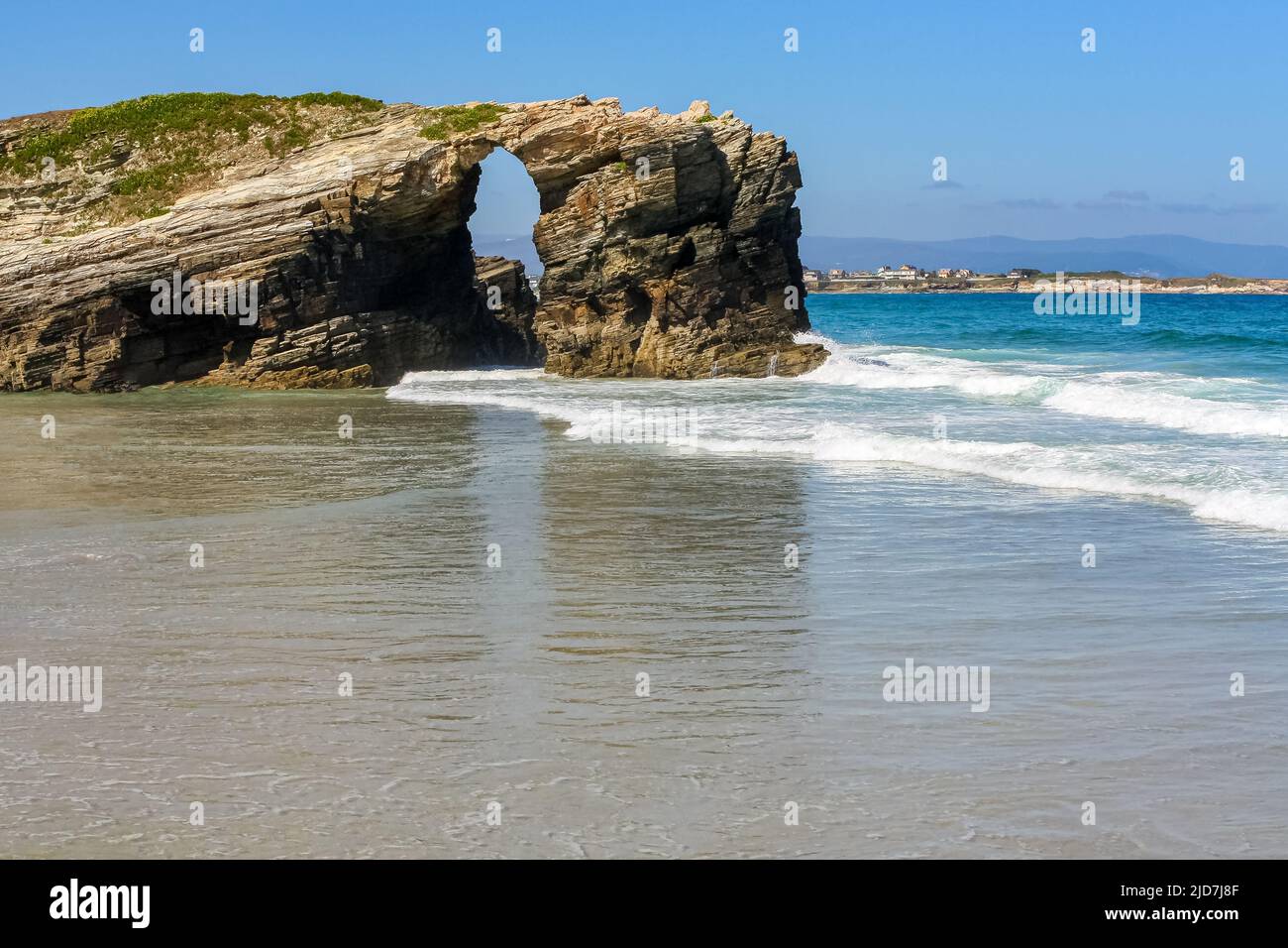 Stone arch on the beach of the cathedrals, famous place in Galicia ...