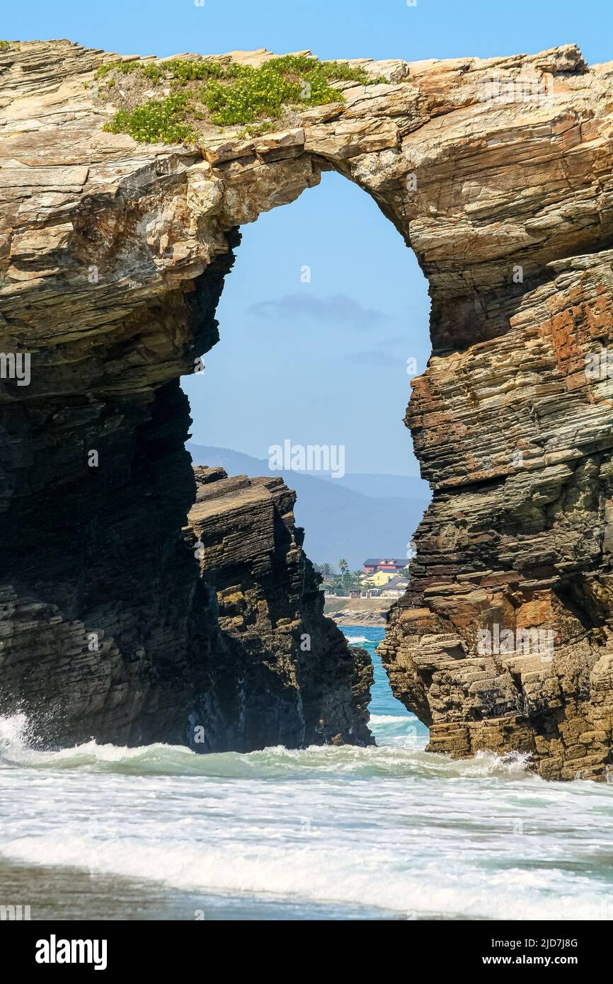 Large stone arch on the seashore, in the famous beach of the cathedrals ...