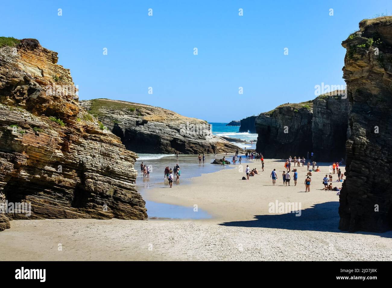 People sunbathing on the idyllic Las Catedrales beach in Galicia Spain ...