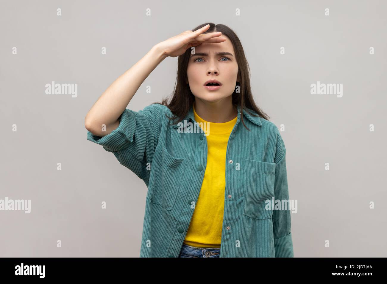 Woman peering over hi-res stock photography and images - Alamy