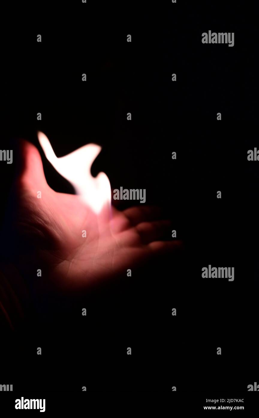 Hand and flame hi-res stock photography and images - Alamy