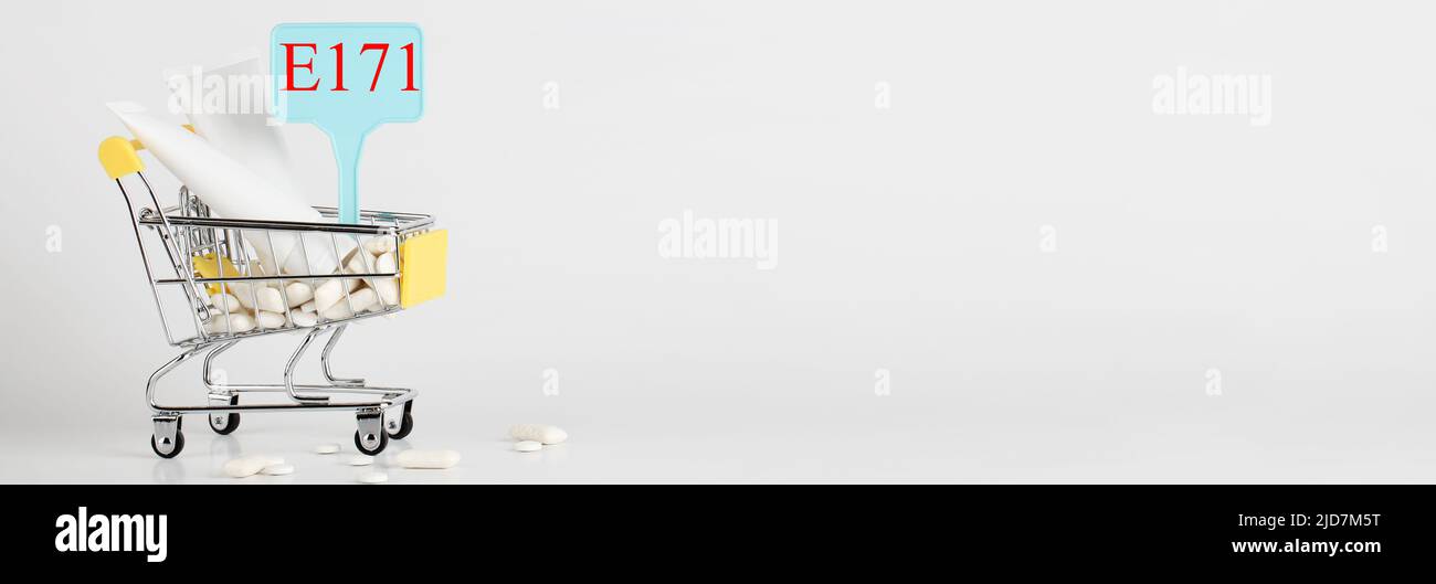 Titanium dioxide, E171, dangerous additive concept. gum, pills ...