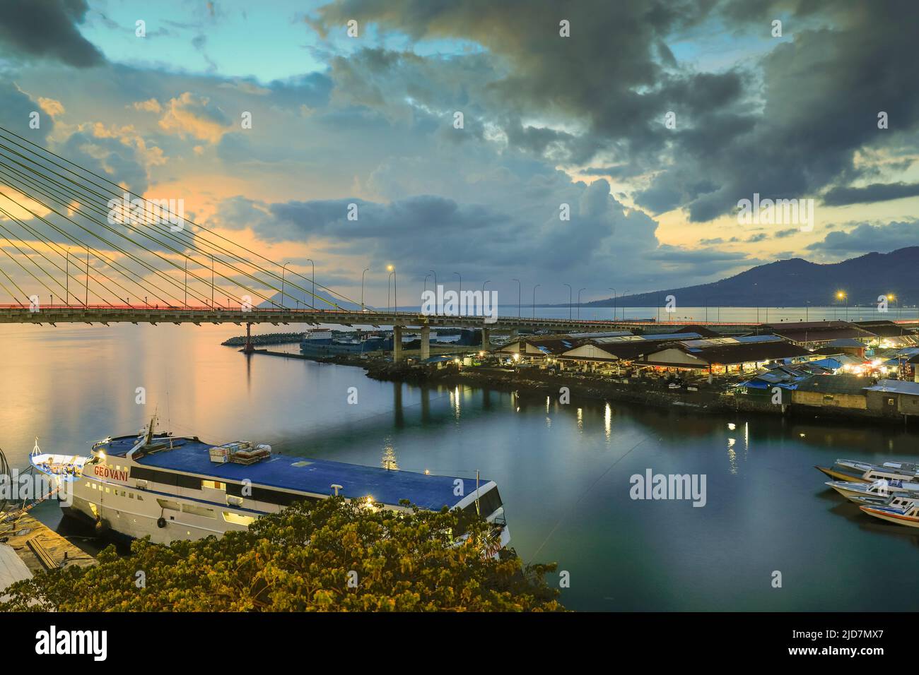 Manado port & Soekarno Bridge at sunset in the provincial capital of ...