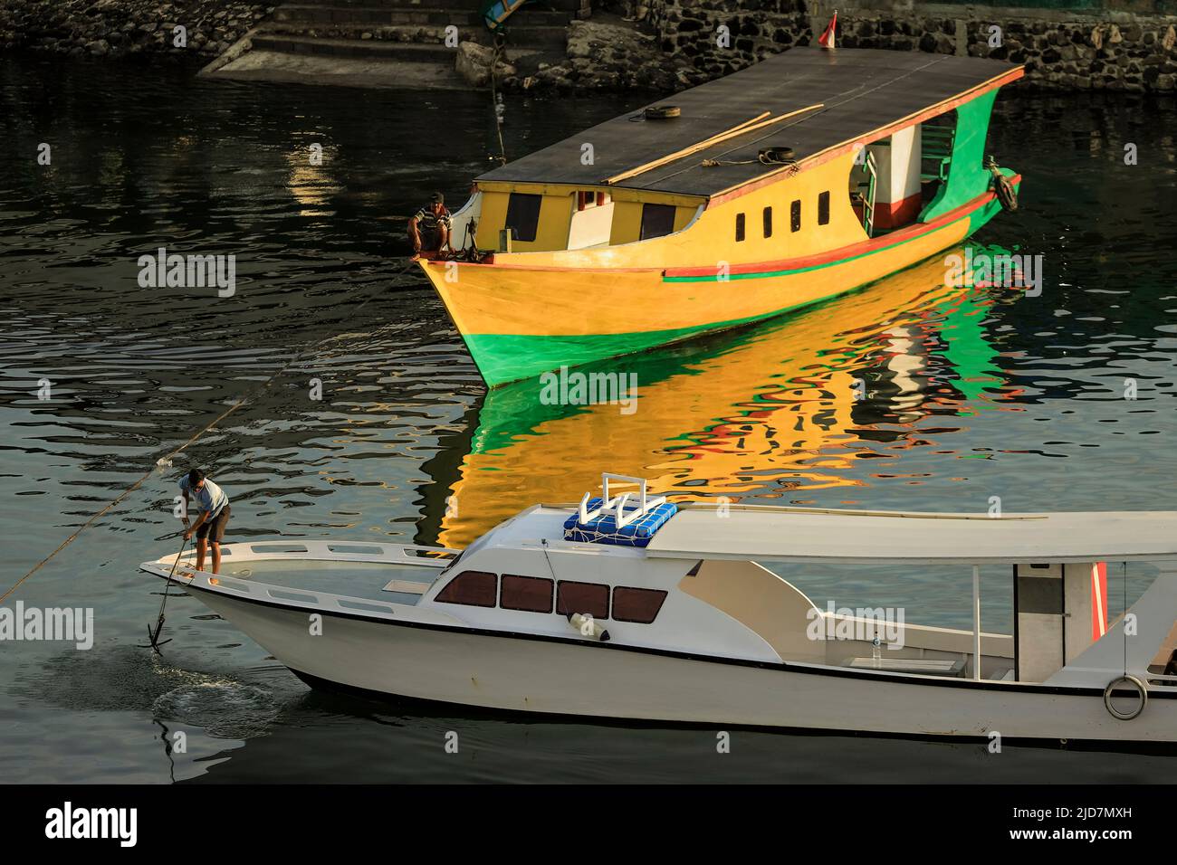 Traditional design ferry boats in the port of this provincial capital ...