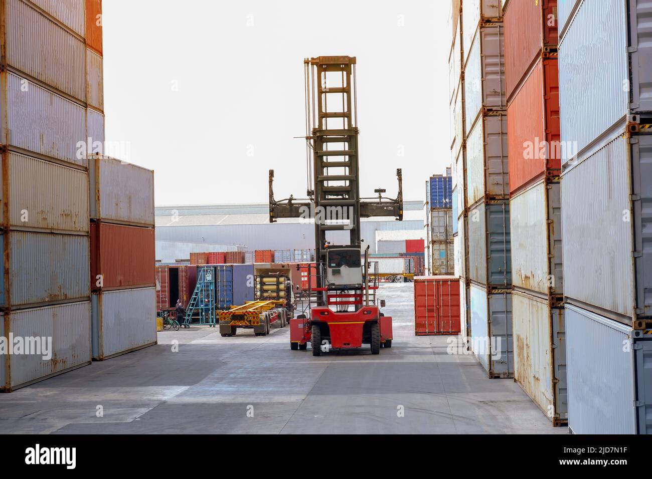 Forklift truck handling container box cargo in logistic delivery yard ...