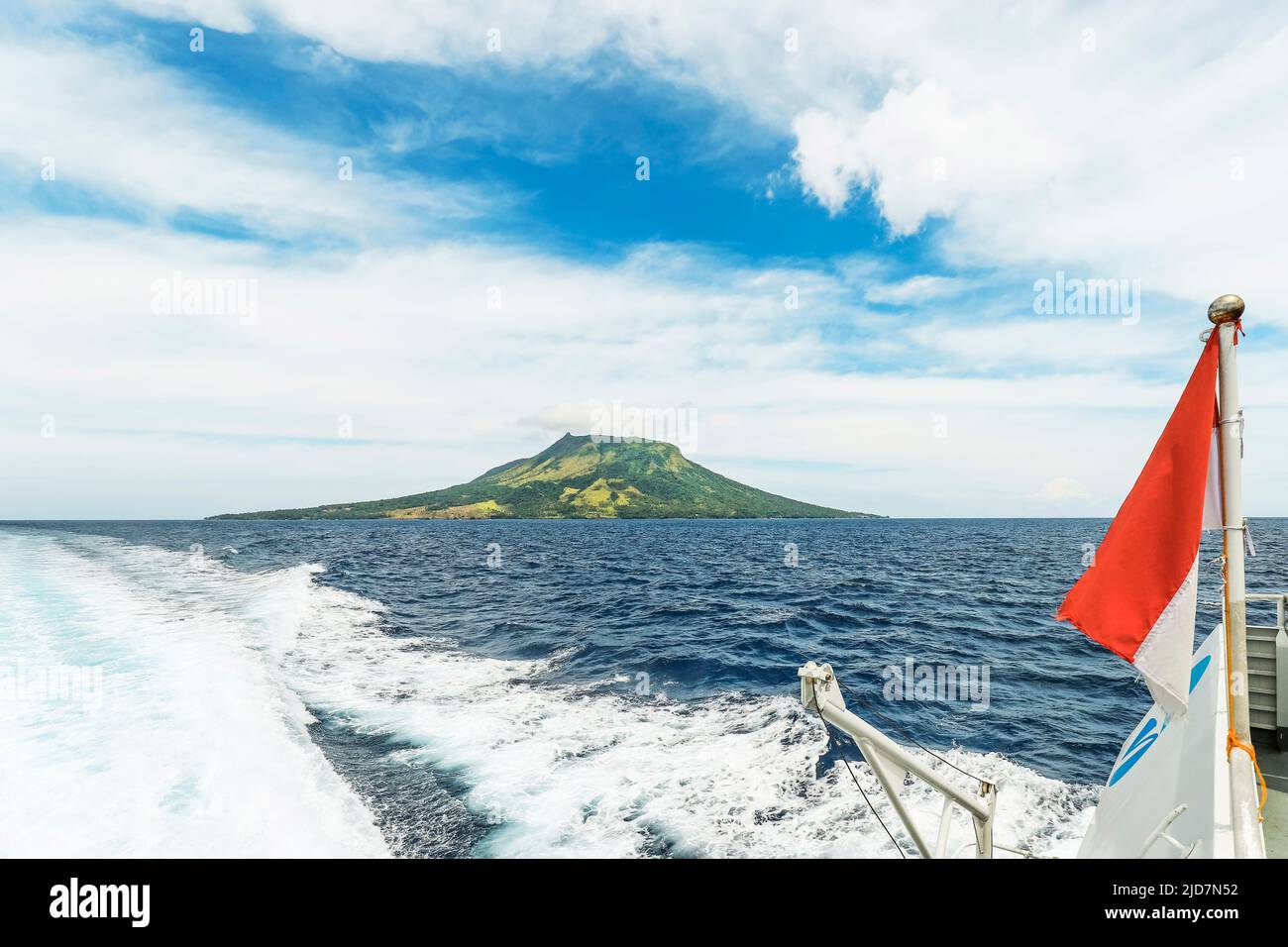 The wake of a fast ferry leaving Tagulandang island & Gunung Ruang ...