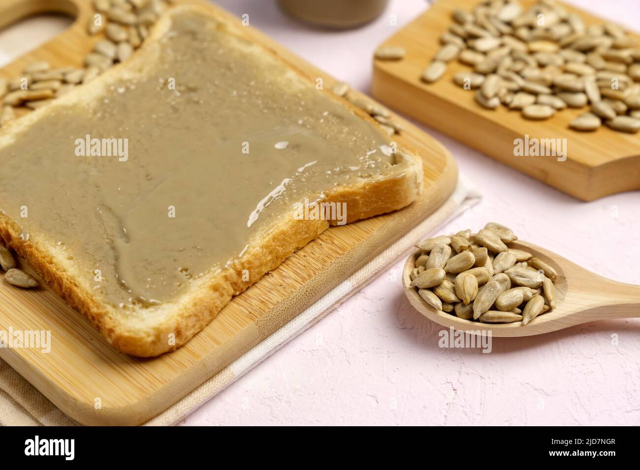 Toast bread with sunflower seeds. Sunflower butter is a new trend and a ...
