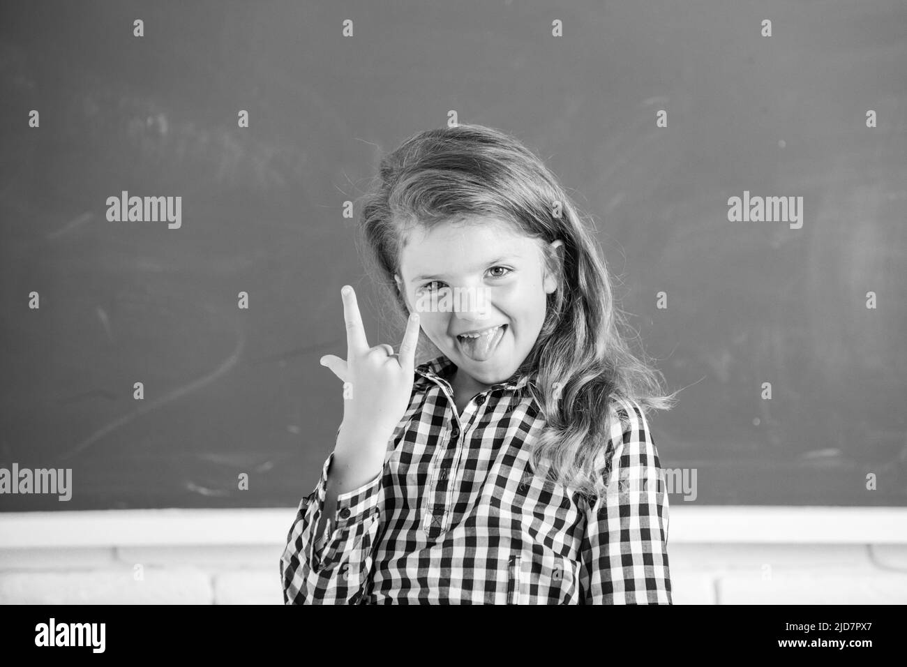 Portrait of funny pupil girl of primary school study. Funny kid girl at ...