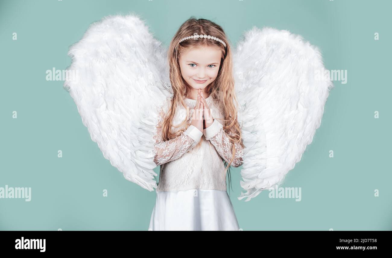 Child with angelic face. Cute child girl posing with angel wings ...